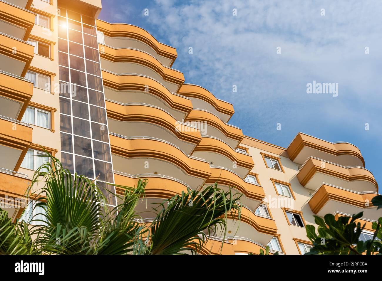Low angle view of an apartment building with balconies. Residential ...