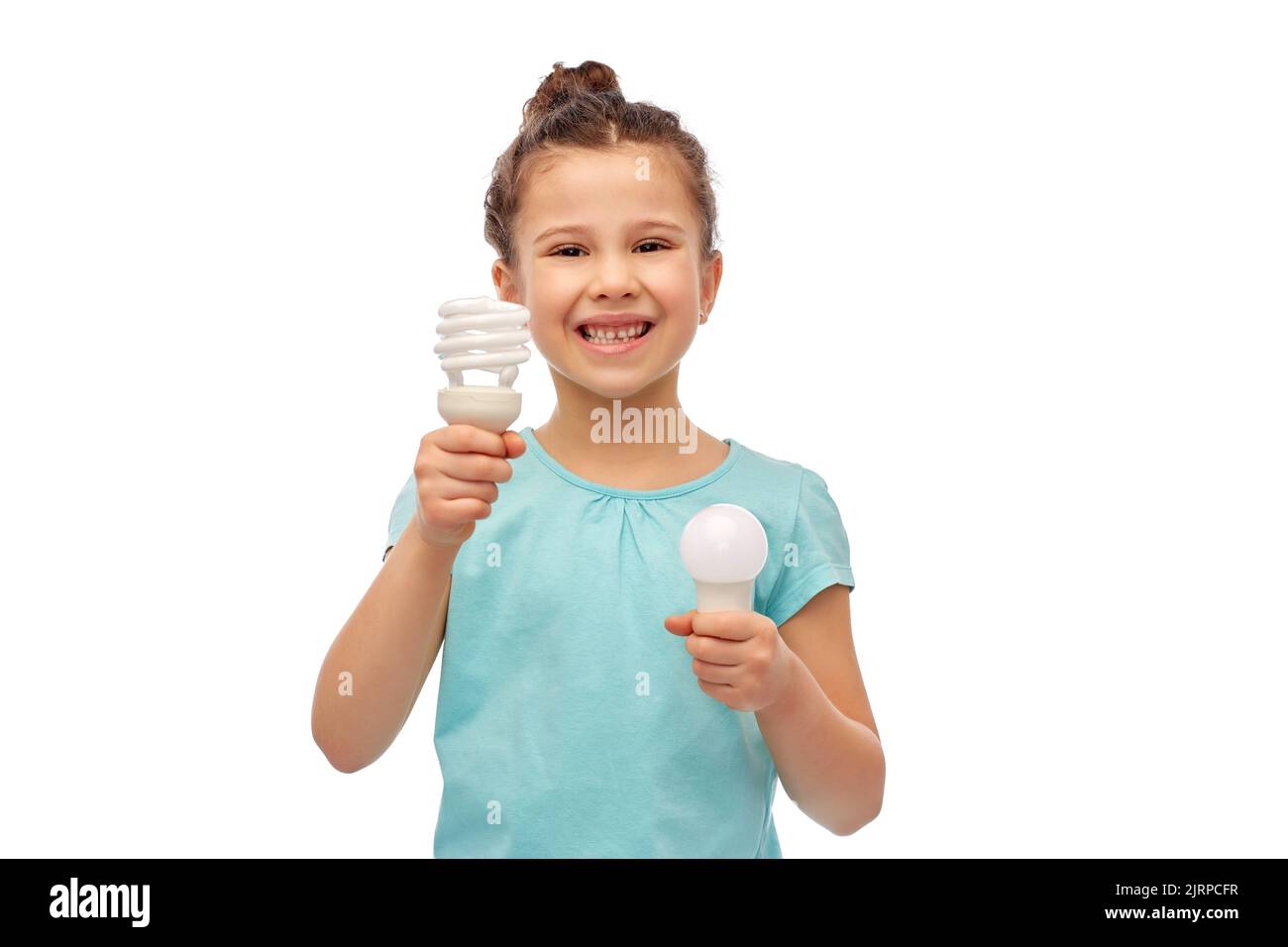 smiling girl comparing different light bulbs Stock Photo - Alamy
