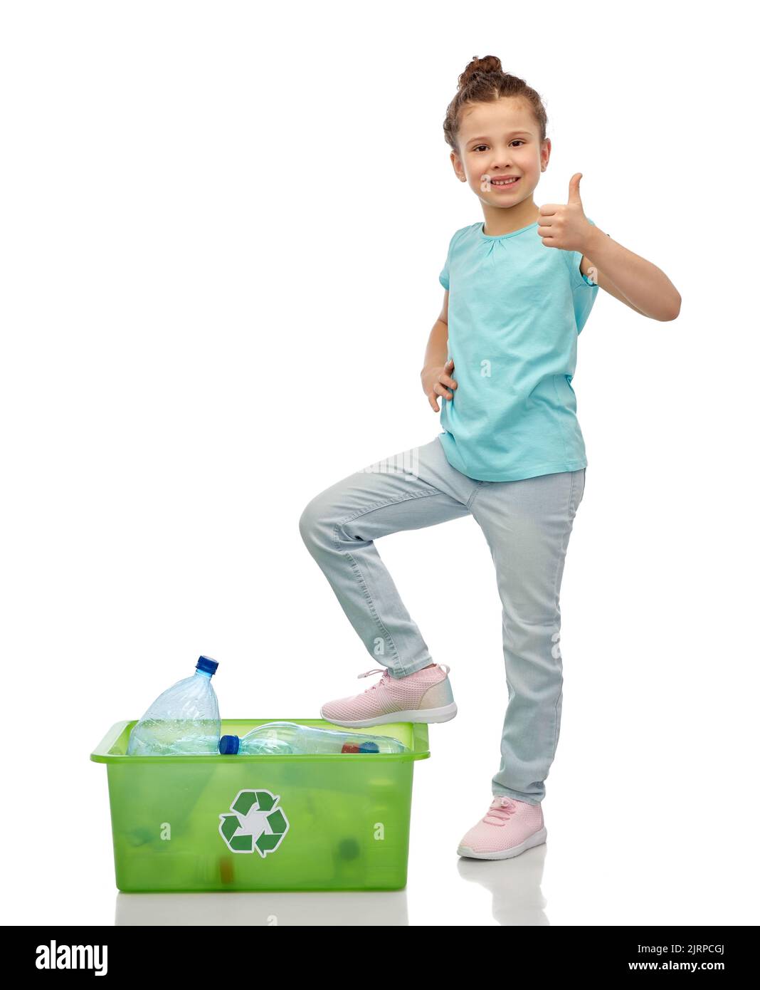 girl sorting plastic waste and showing thumbs up Stock Photo - Alamy