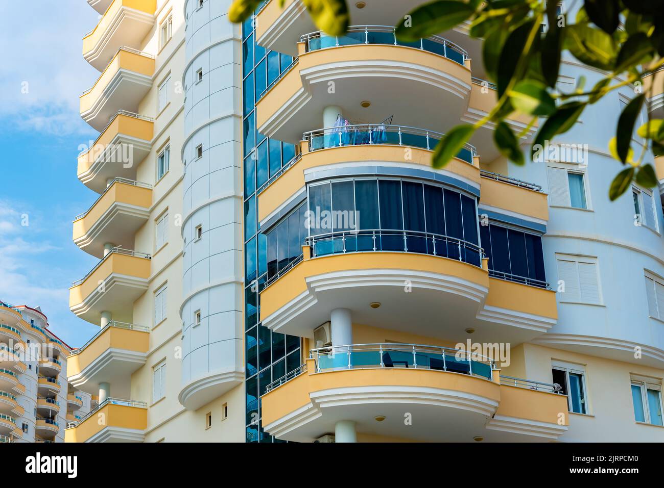Low angle view of an apartment building with balconies. Residential ...
