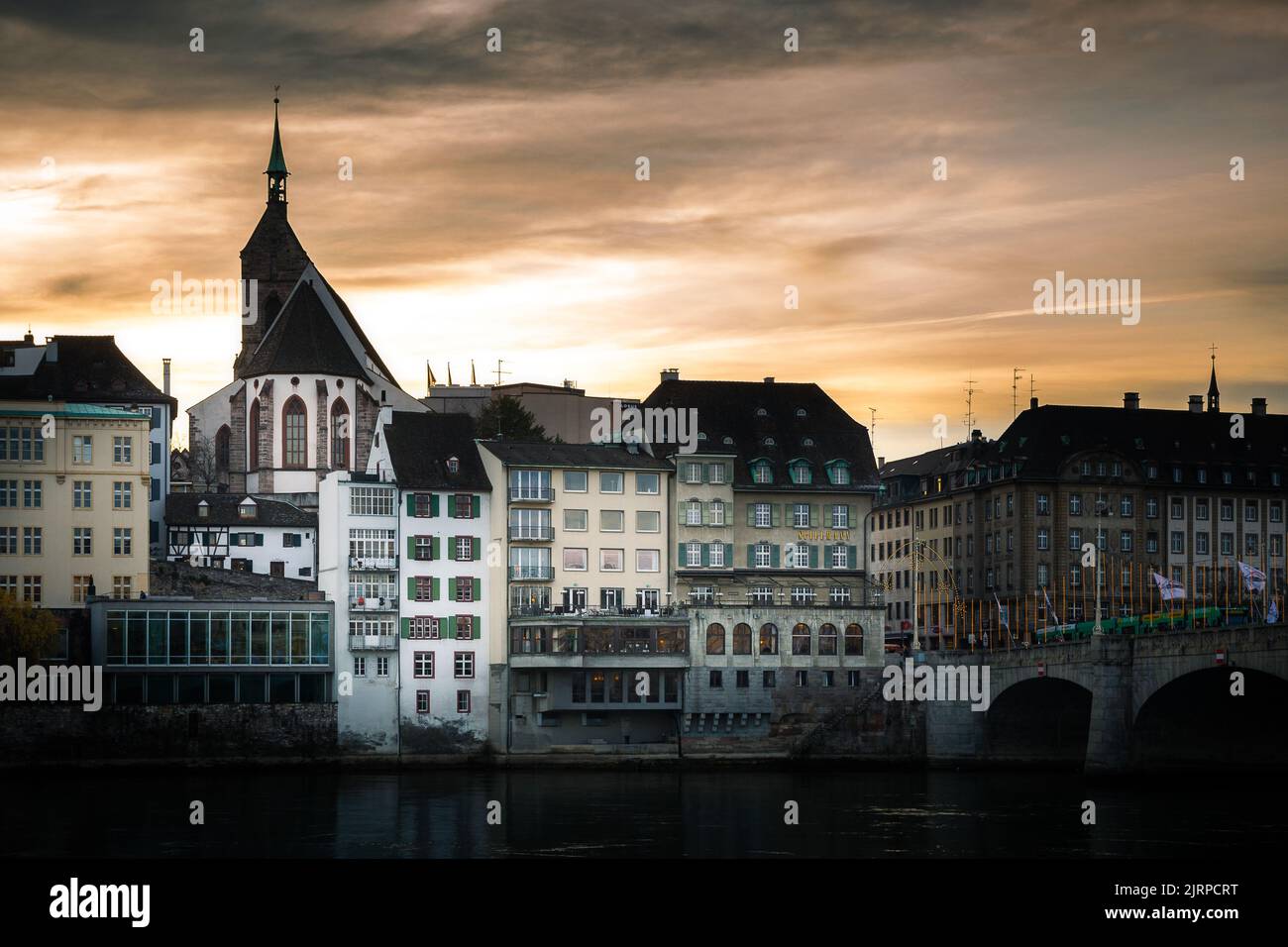 A beautiful view of old buildings and a Middle Bridge in Basel during ...