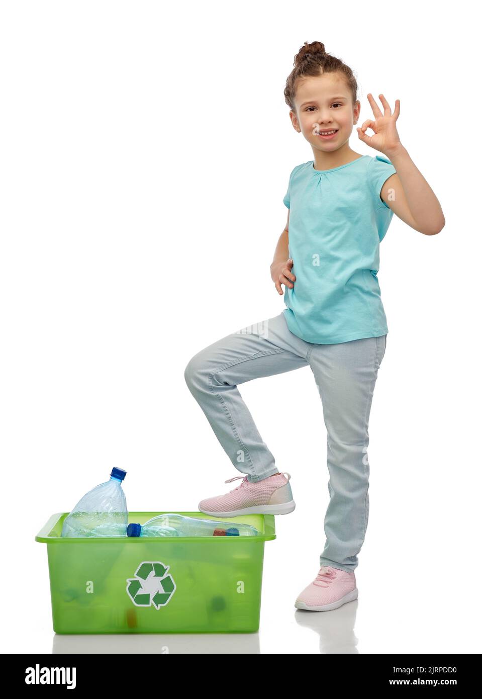 smiling girl sorting plastic waste showing ok sign Stock Photo - Alamy