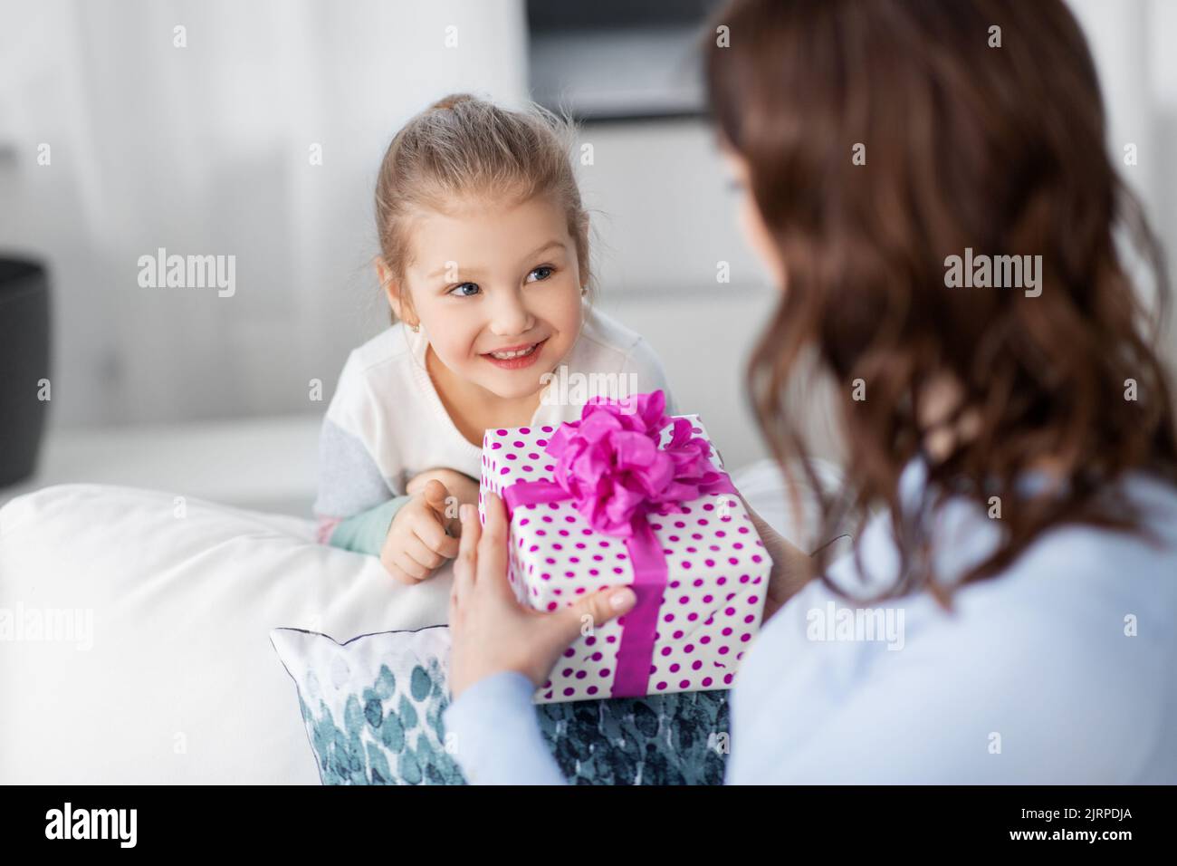 happy daughter giving present to mother at home Stock Photo - Alamy