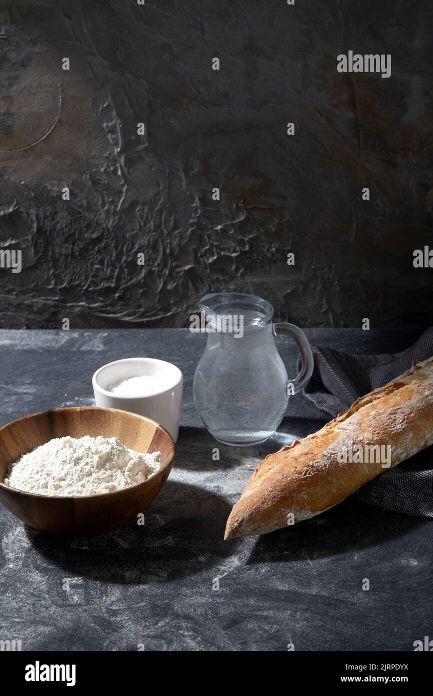 bread, wheat flour, salt and water in glass jug Stock Photo - Alamy