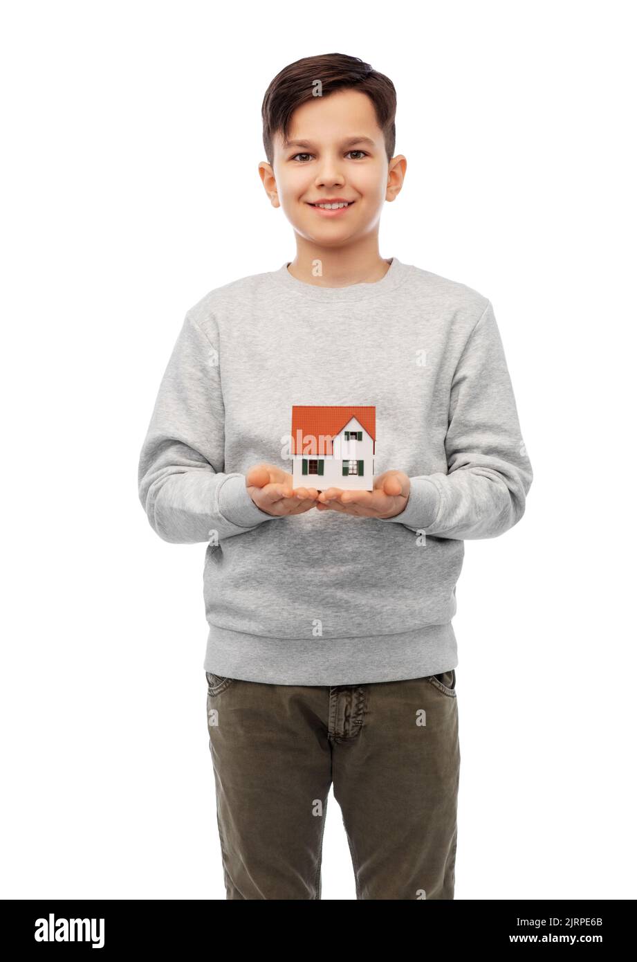 smiling boy holding house model Stock Photo - Alamy
