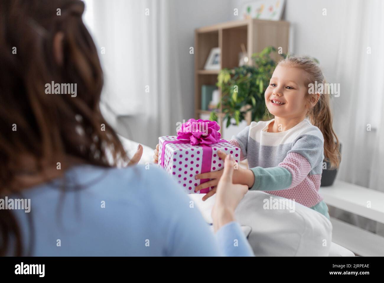 happy daughter giving present to mother at home Stock Photo - Alamy