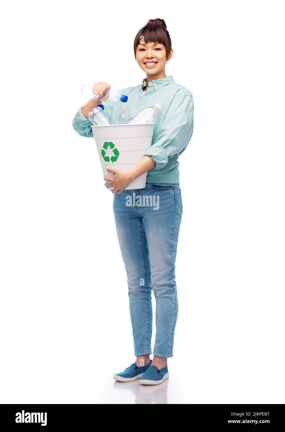 smiling young woman sorting plastic waste Stock Photo - Alamy