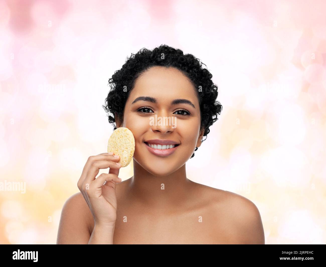 Black afro woman cleaning skin hi-res stock photography and images - Alamy