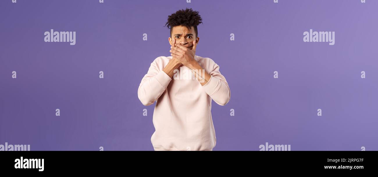 Shocked worried, embarrassed young man said something he shouldnt have ...