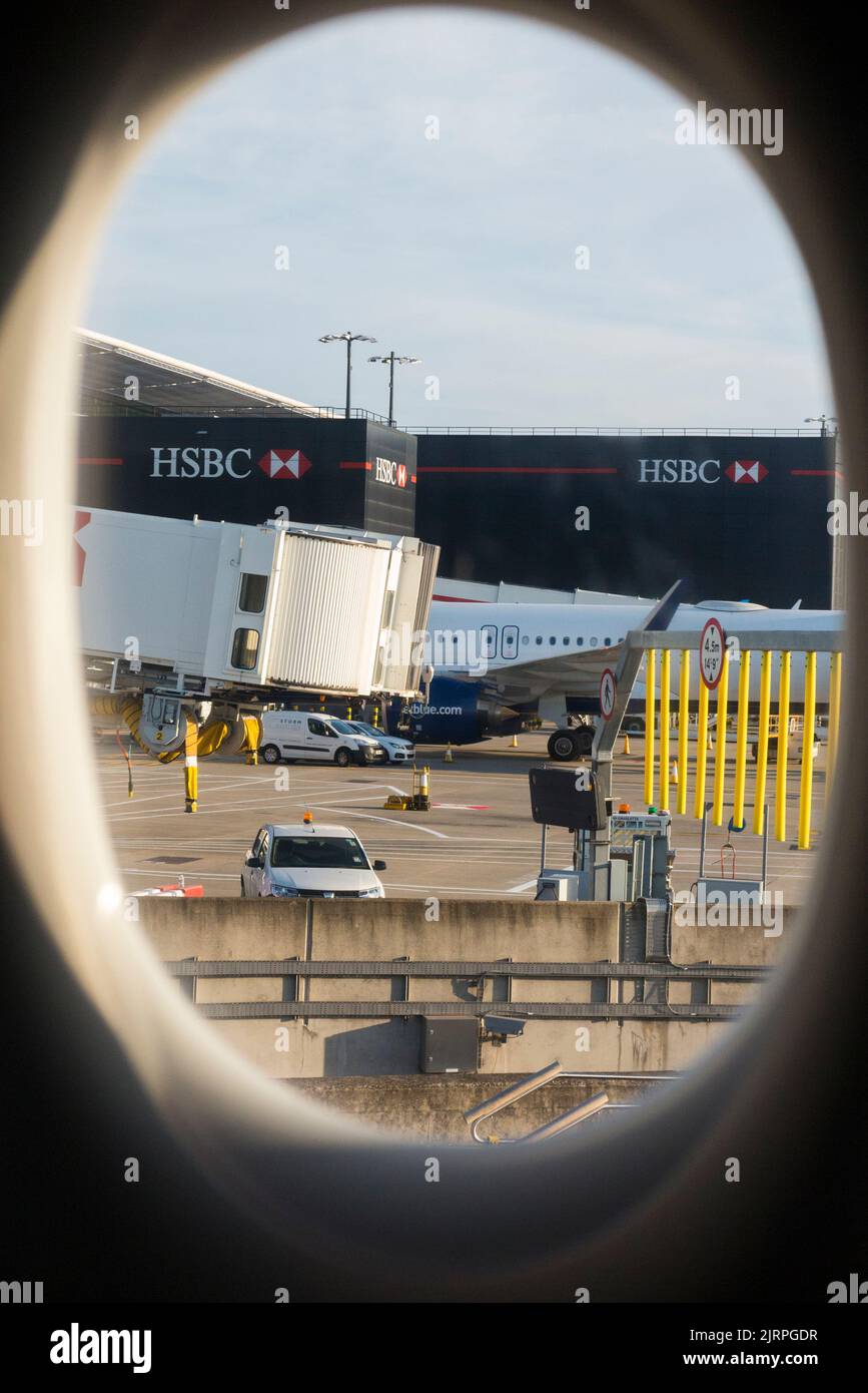 HSBC bank sponsorship adorning airport buildings, jet bridge and sky ...