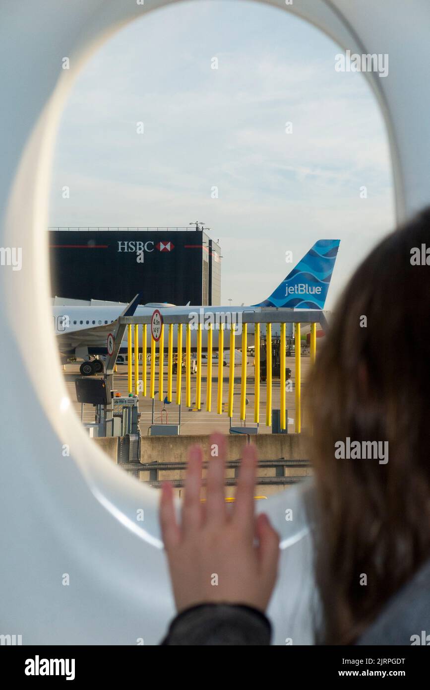 HSBC bank sponsorship adorning airport buildings, jet bridge and sky ...