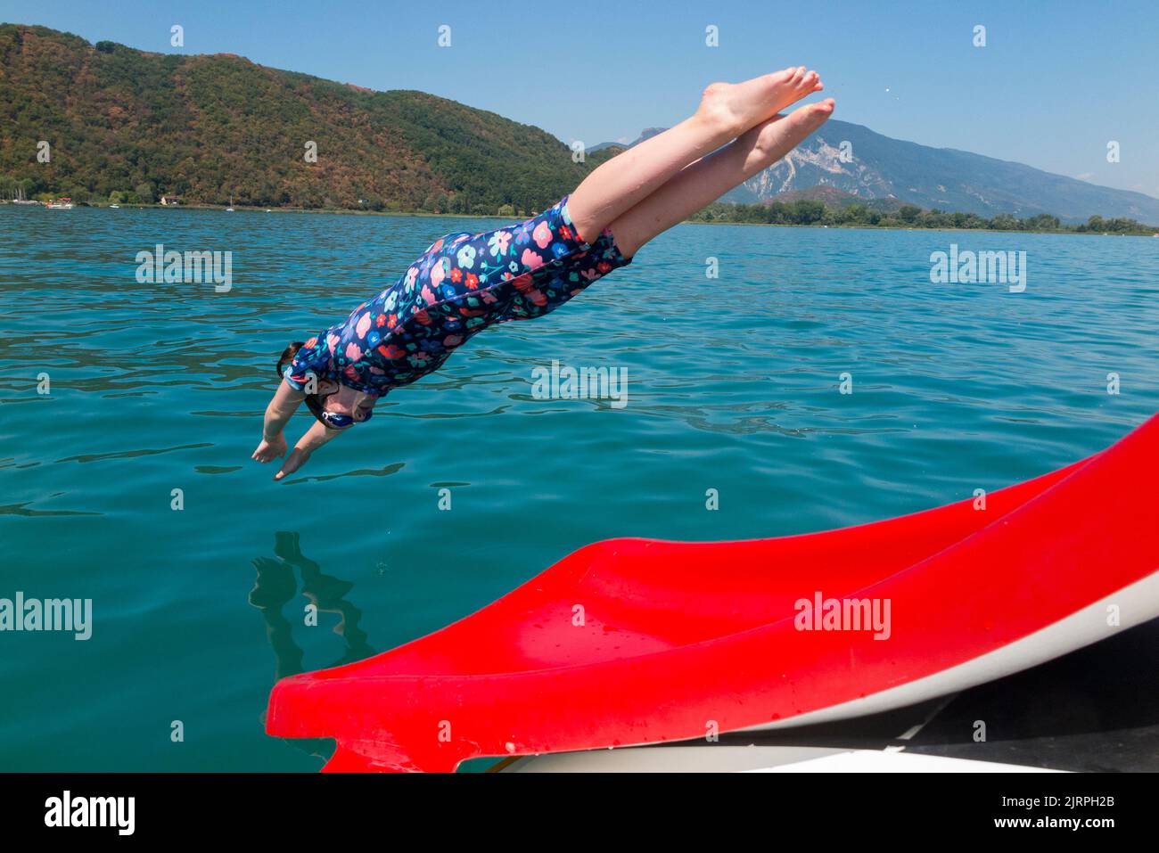 Girl head first on a slide hi-res stock photography and images - Alamy