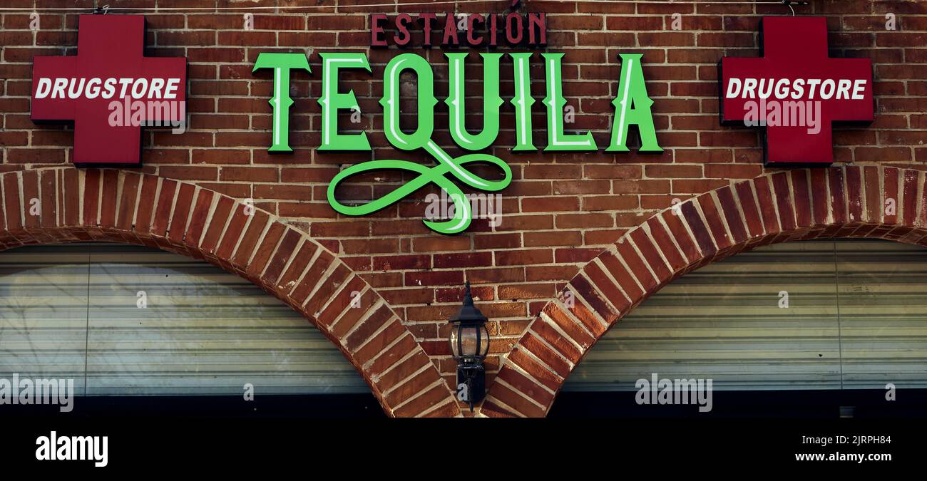 A closeup of Tequila sign on a brick building in Playa del Carmen ...