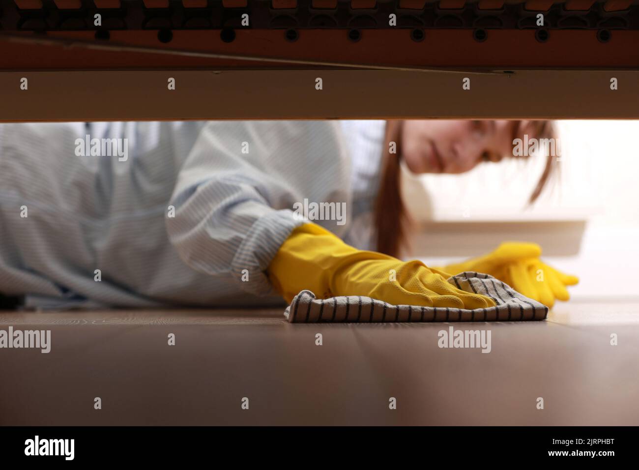 Cleaning and disinfection of surfaces. Woman with yellow rubber gloves ...
