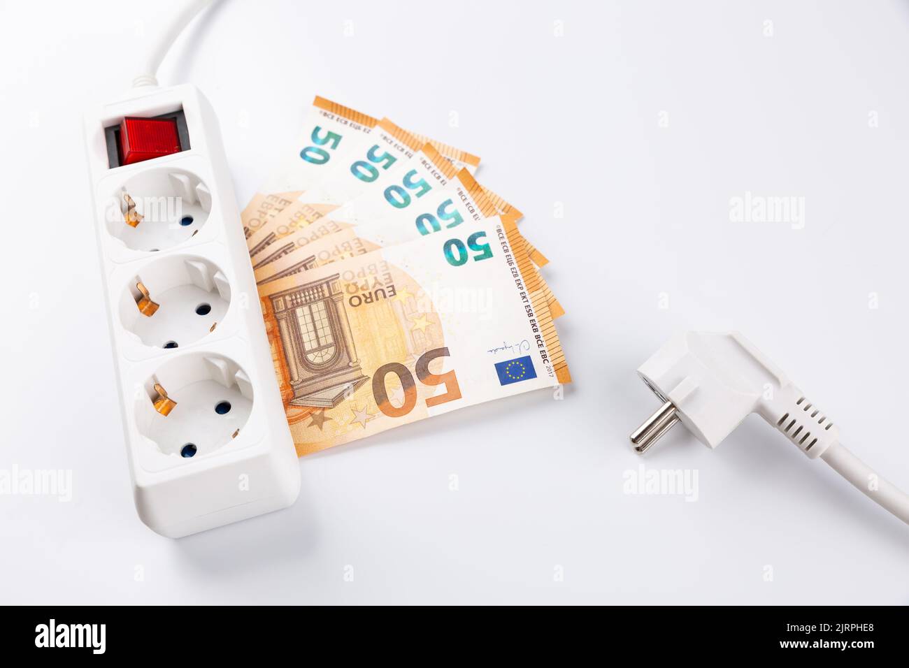 electric plug with several connections and 50 euro bills. High price of ...