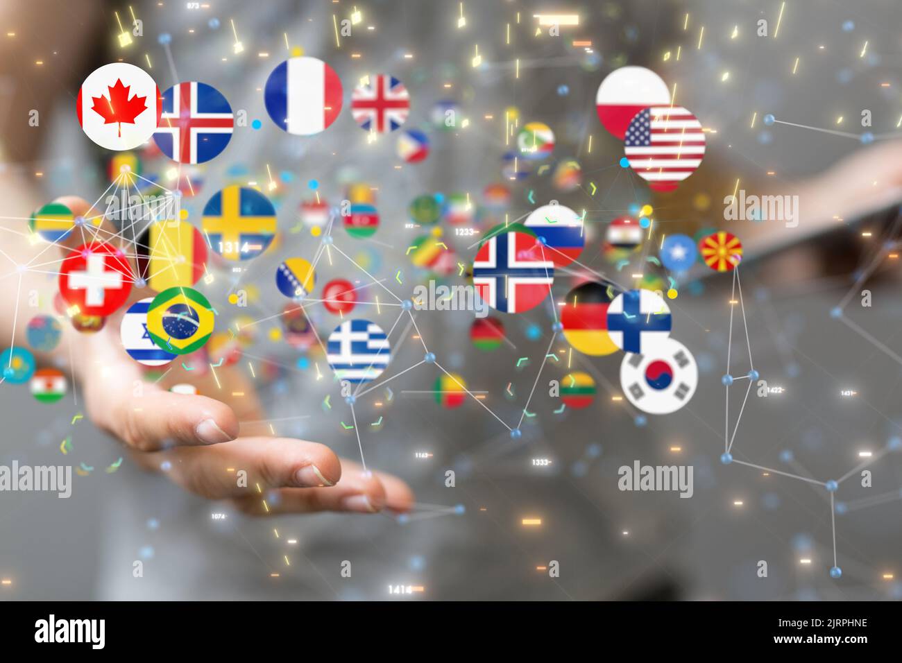 A 3d floating digital illustration of world flags over a hand- the ...