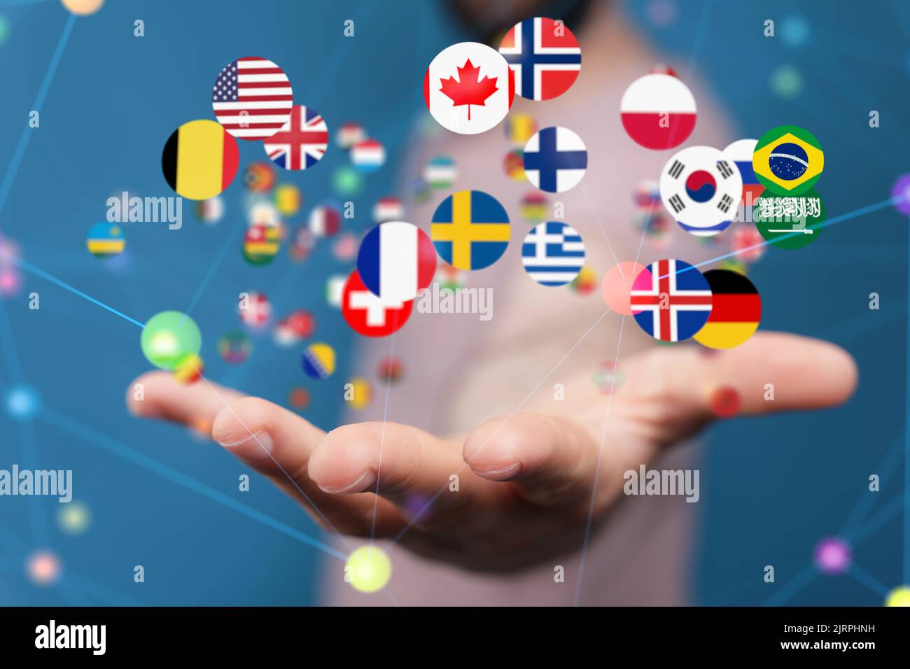 A 3d floating digital illustration of world flags over a hand- the ...