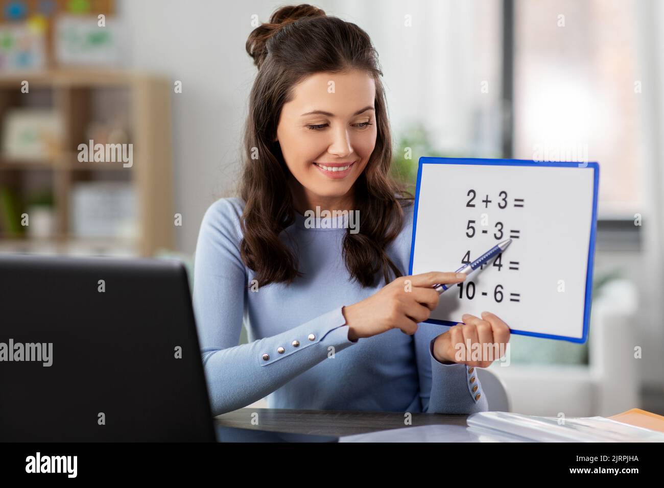 math teacher having online class at home Stock Photo - Alamy