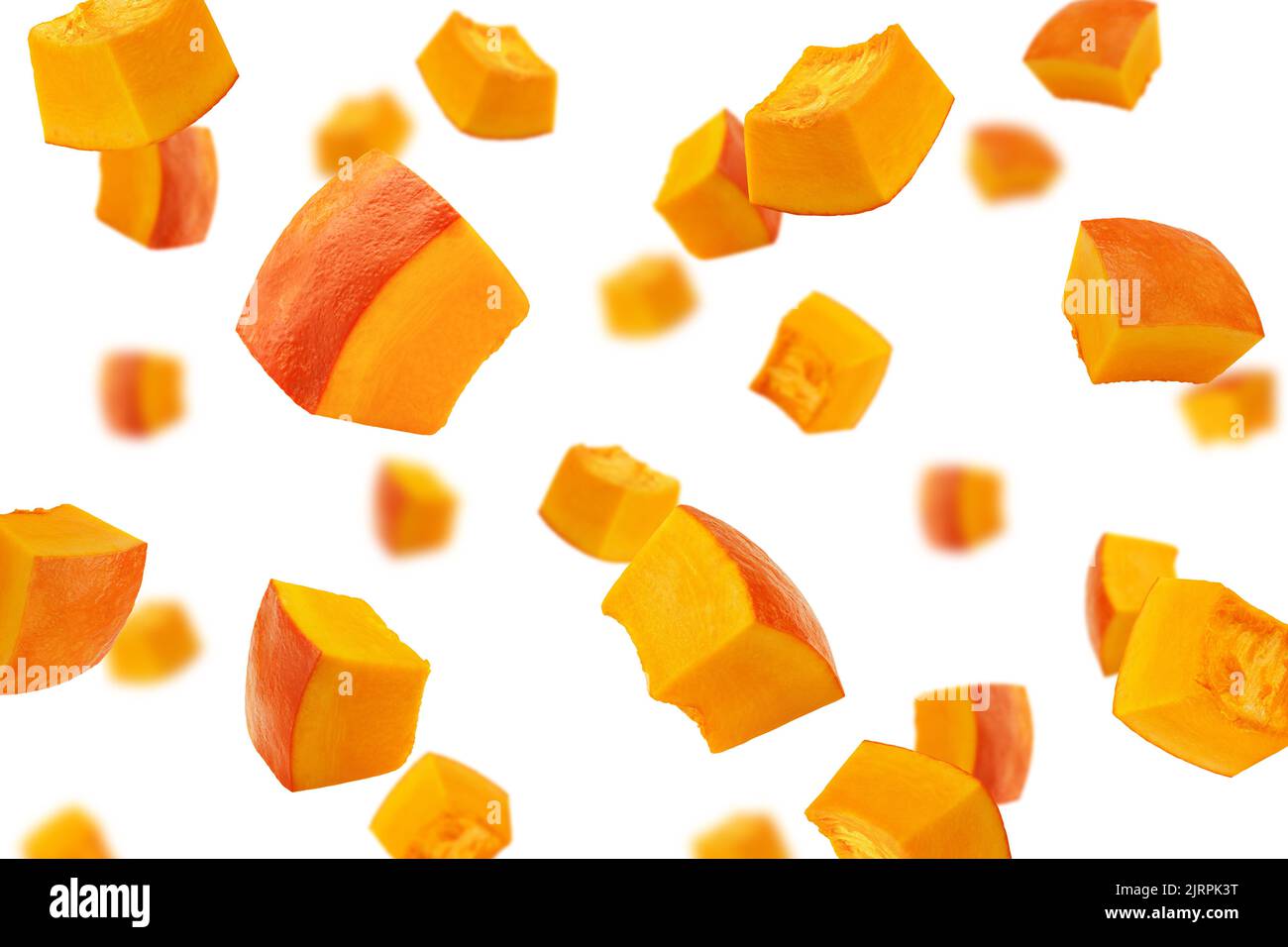 Falling piece of pumpkin, cubes, isolated on white background ...