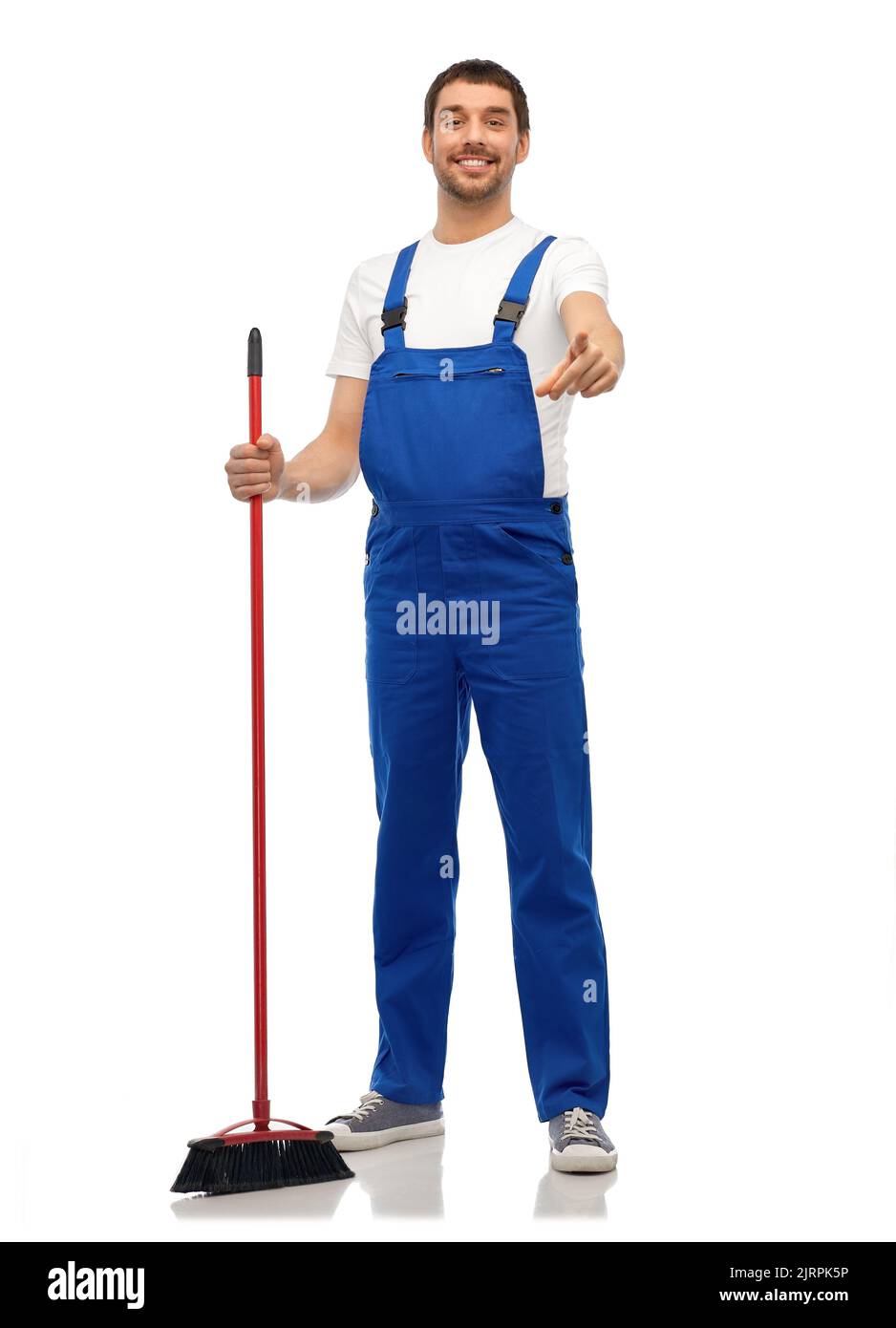 male cleaner in overall cleaning floor with broom Stock Photo - Alamy
