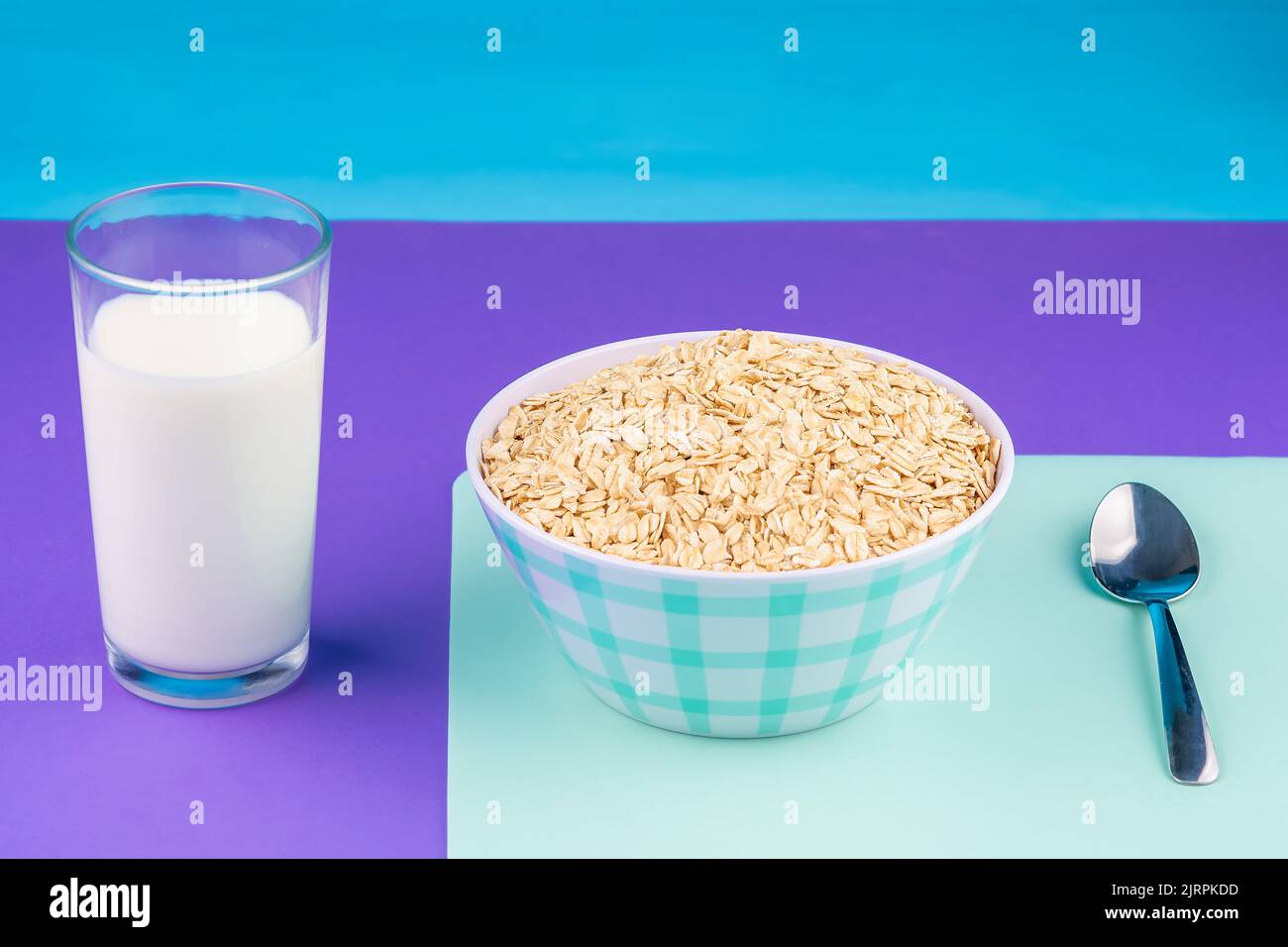 View of a plate of natural oatmeal with bananas and a glass of fresh ...