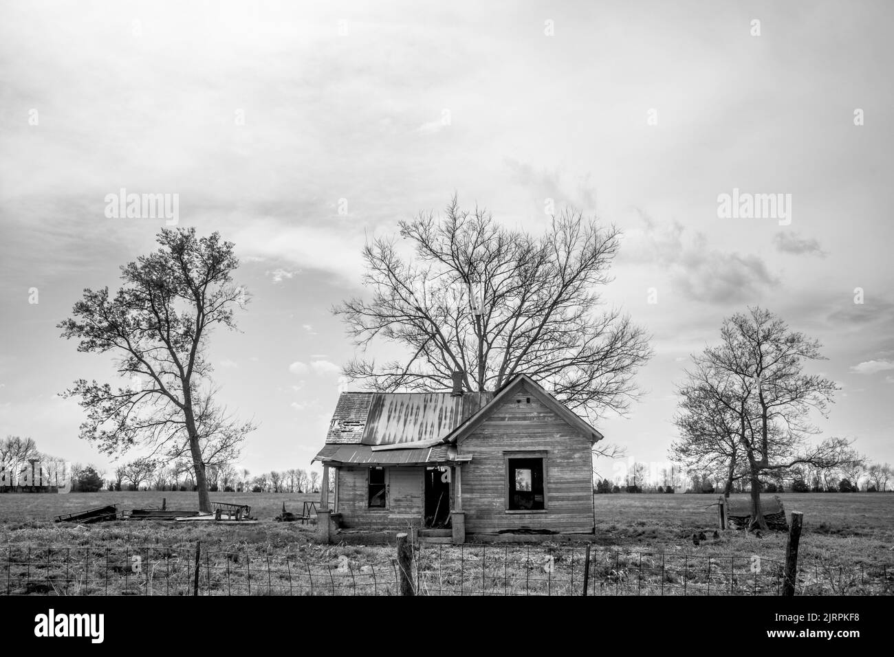 Old run down damaged abandoned house in rural agricultural setting ...