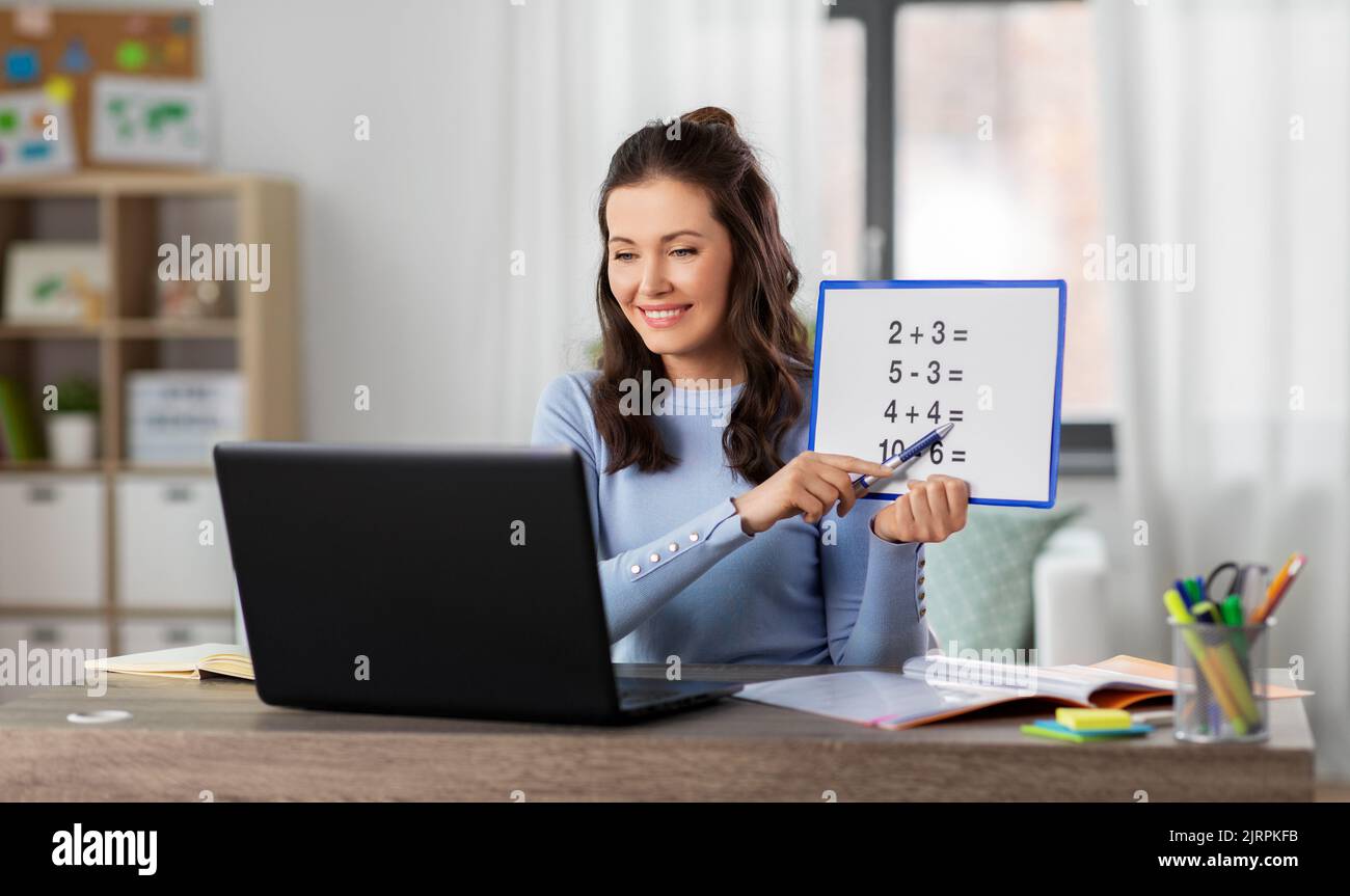 math teacher having online class at home Stock Photo - Alamy