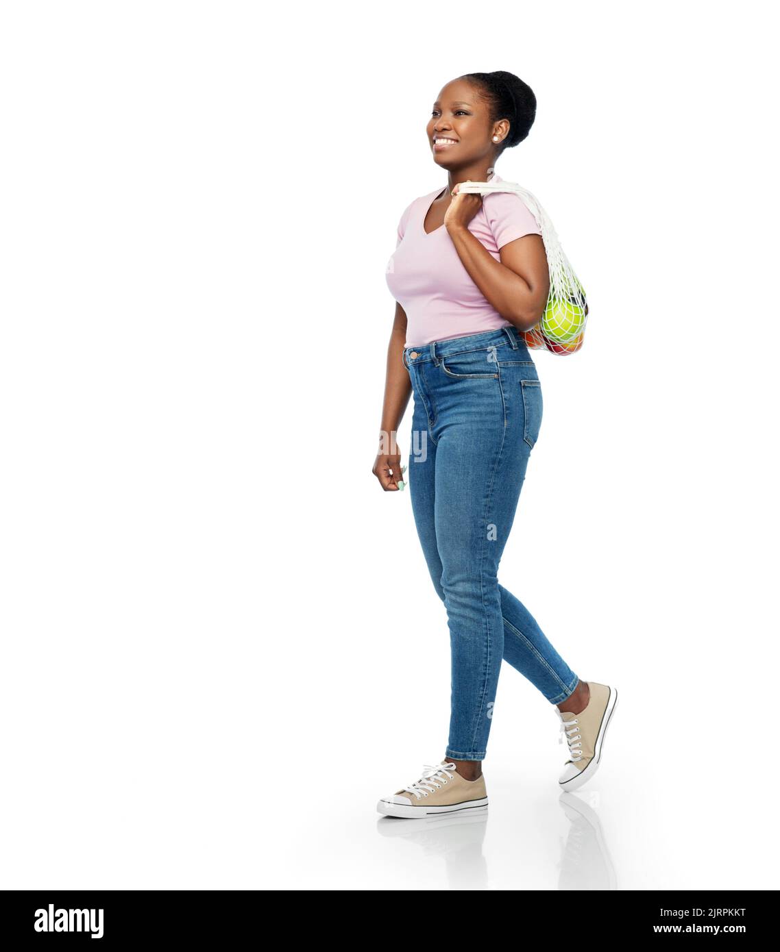 african woman with food in reusable string bag Stock Photo - Alamy