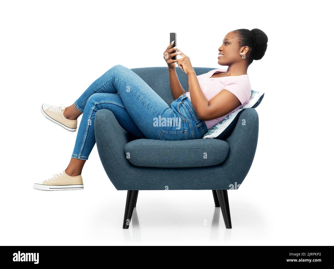 african american woman with smartphone in armchair Stock Photo - Alamy