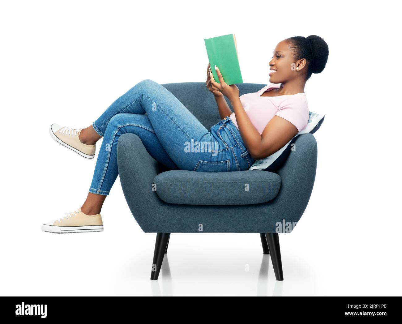 Reading book in chair Cut Out Stock Images & Pictures - Alamy