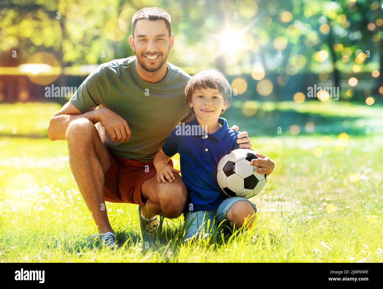father and little son with soccer ball at park Stock Photo - Alamy