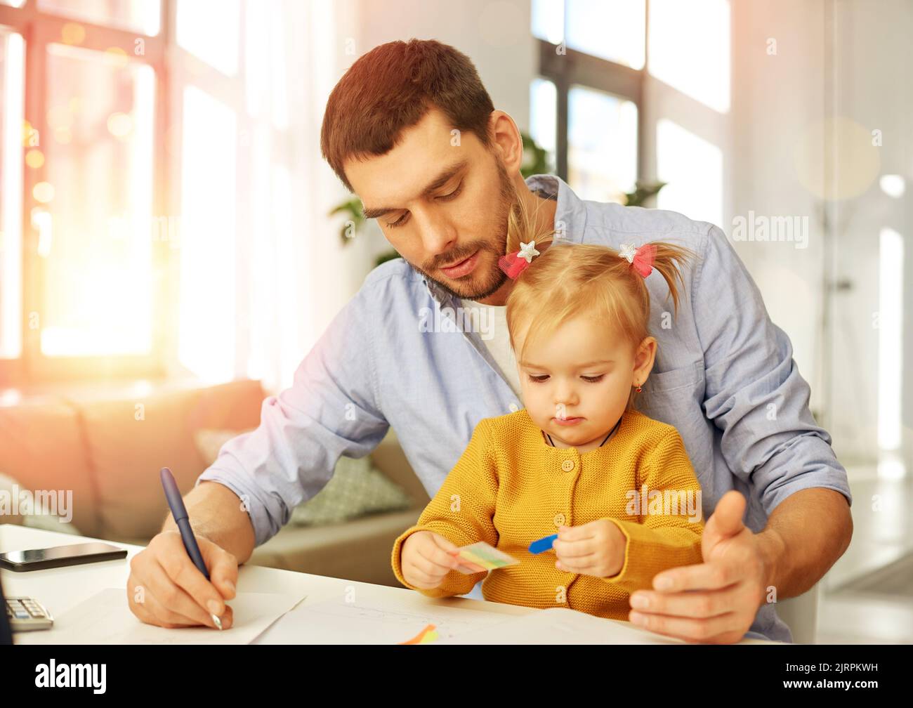 working father with baby daughter at home office Stock Photo - Alamy