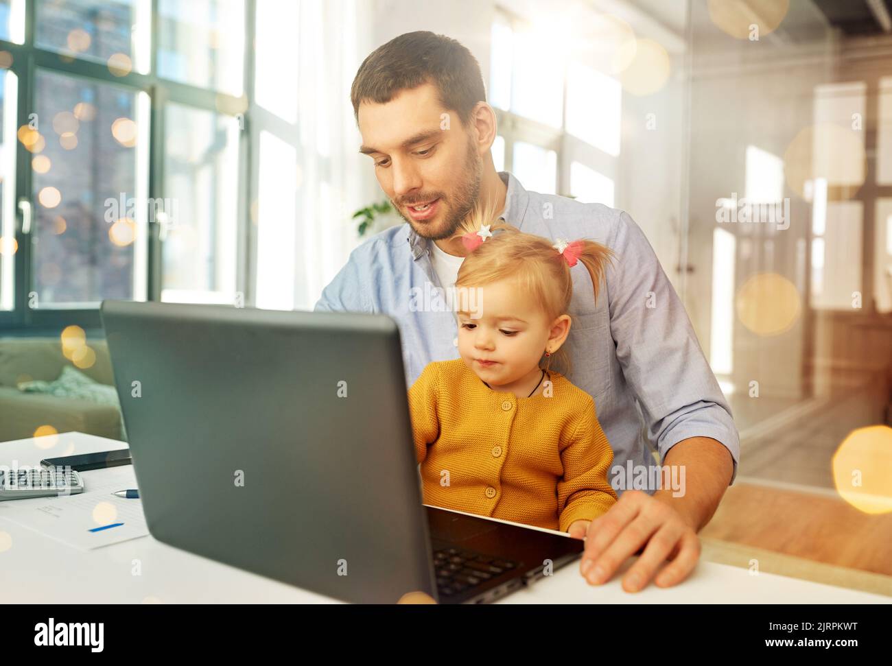 working father with baby daughter at home office Stock Photo - Alamy