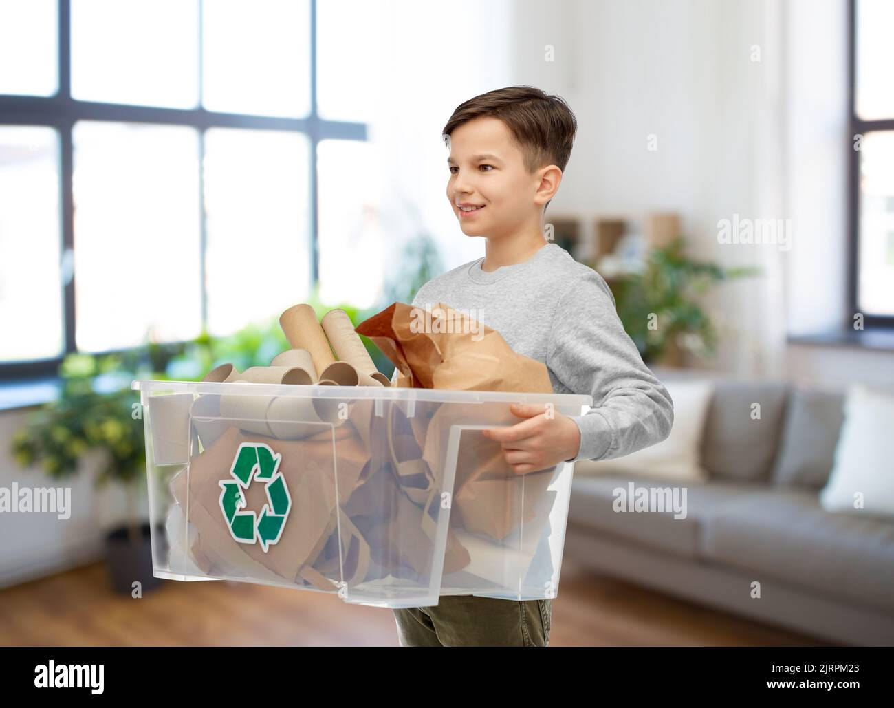 smiling boy sorting paper waste Stock Photo - Alamy