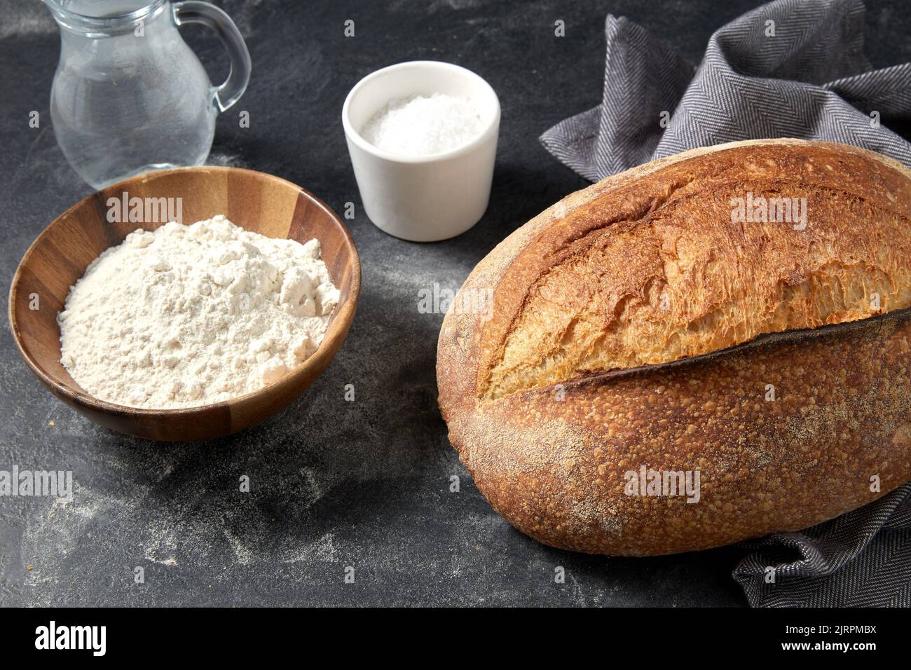 bread, wheat flour, salt and water in glass jug Stock Photo - Alamy