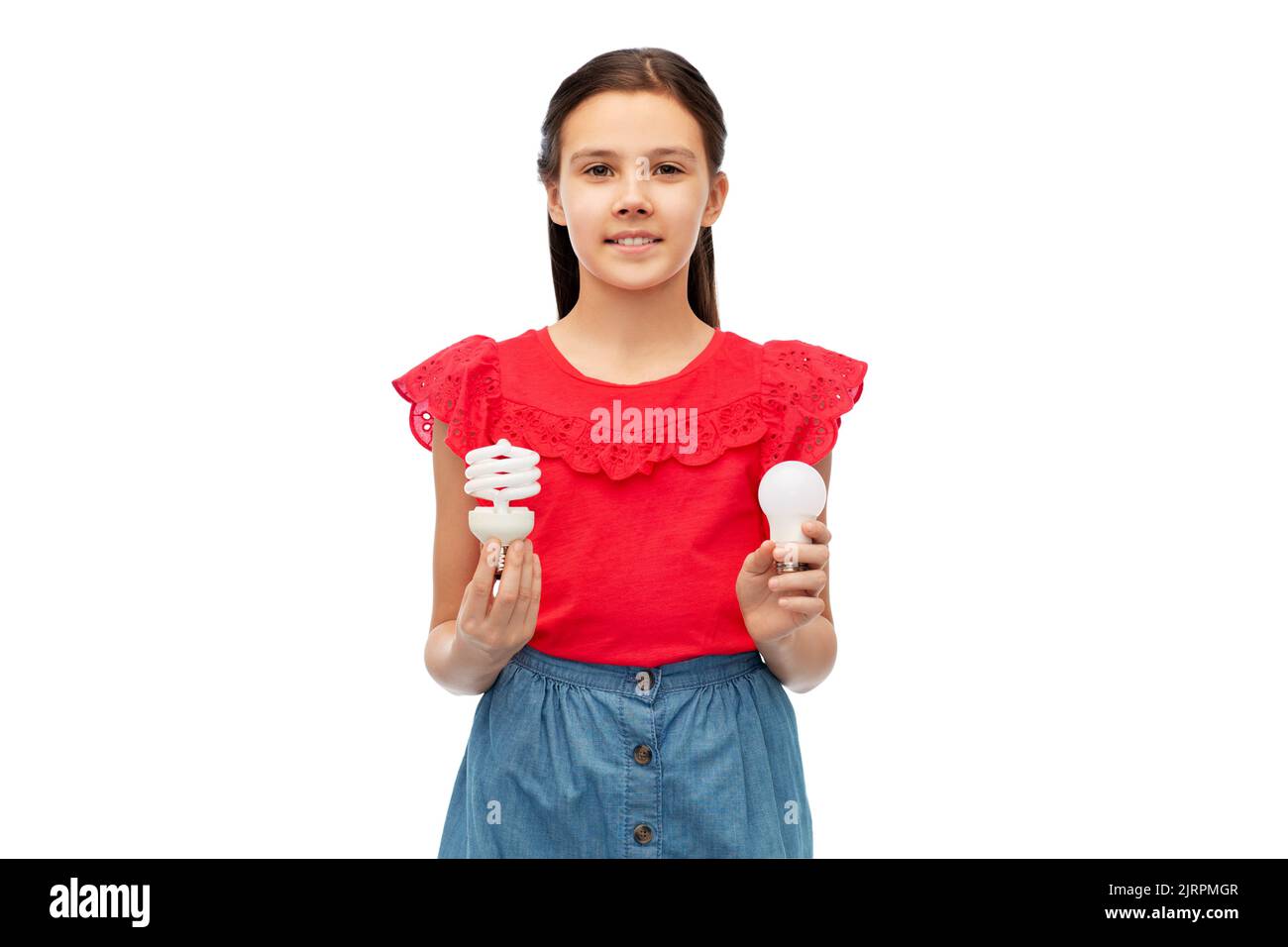 smiling girl comparing different light bulbs Stock Photo - Alamy