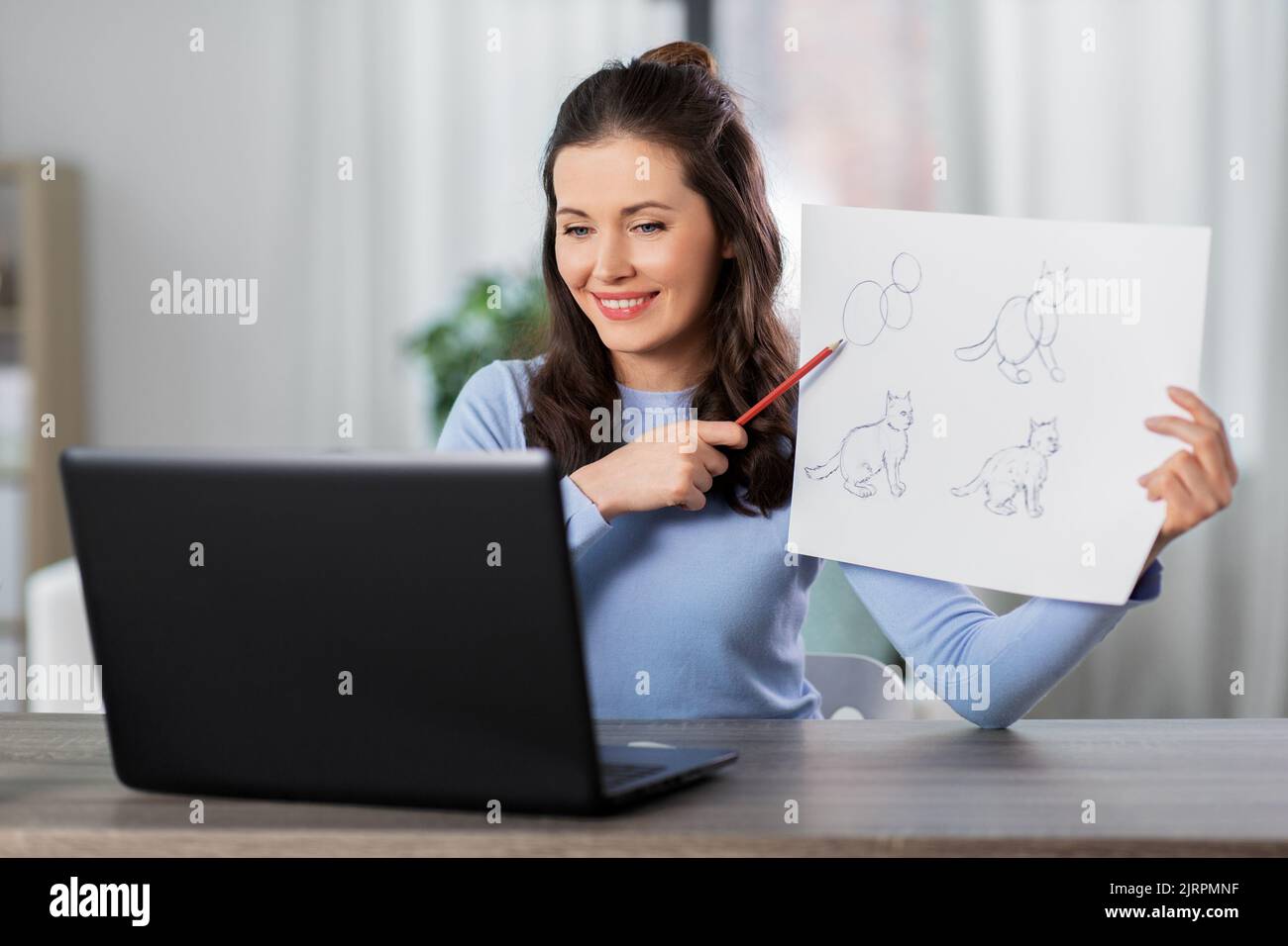 teacher with tutorial having online class of arts Stock Photo - Alamy