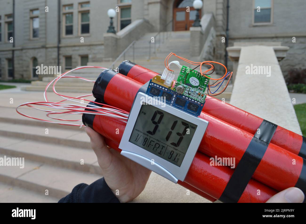 Terrorist in public place with time bomb Stock Photo - Alamy