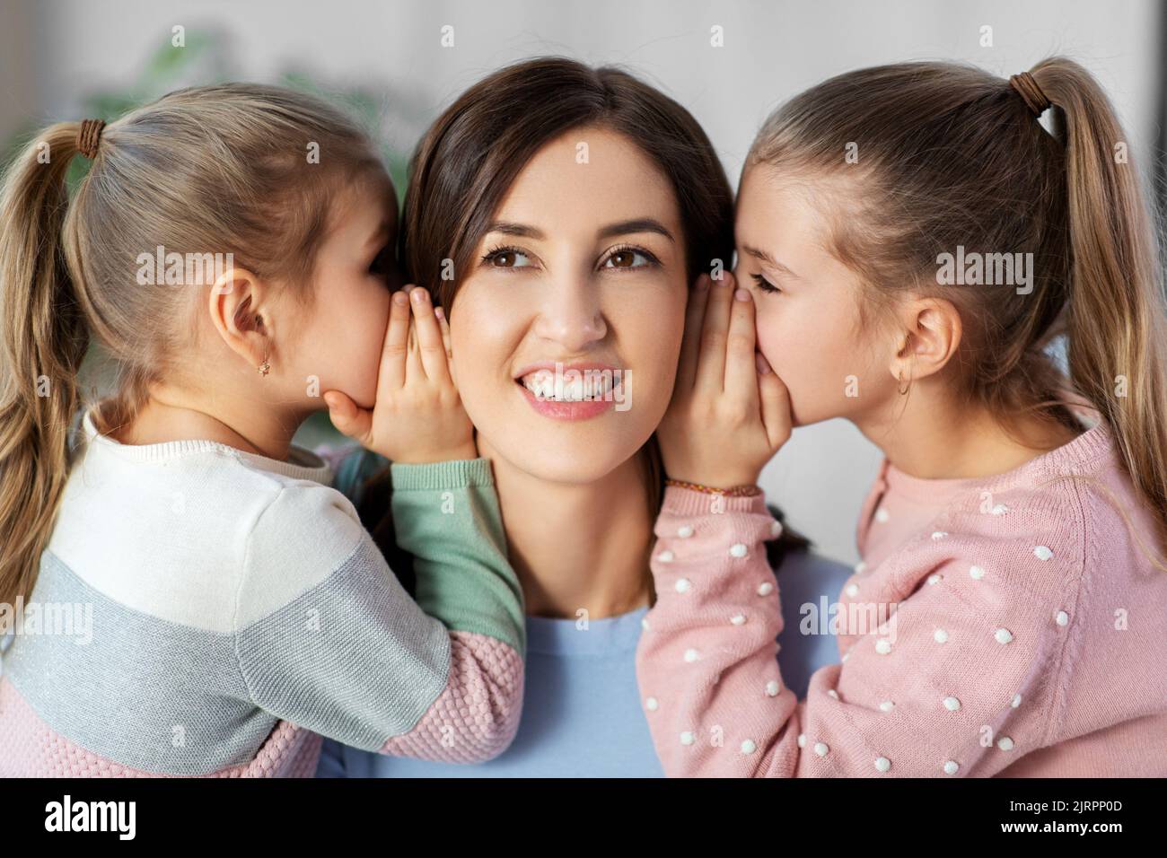 happy mother and daughters gossiping at home Stock Photo - Alamy