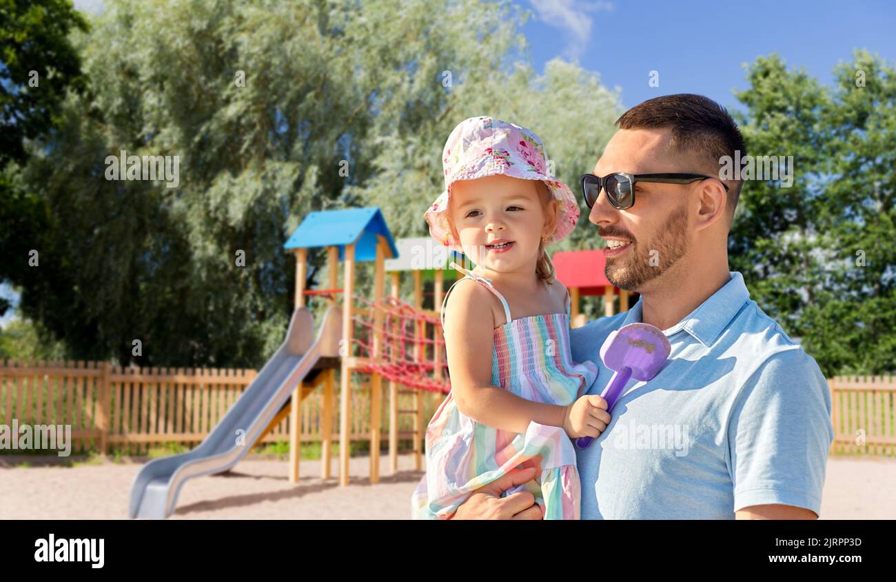 happy father with little daughter on playground Stock Photo - Alamy
