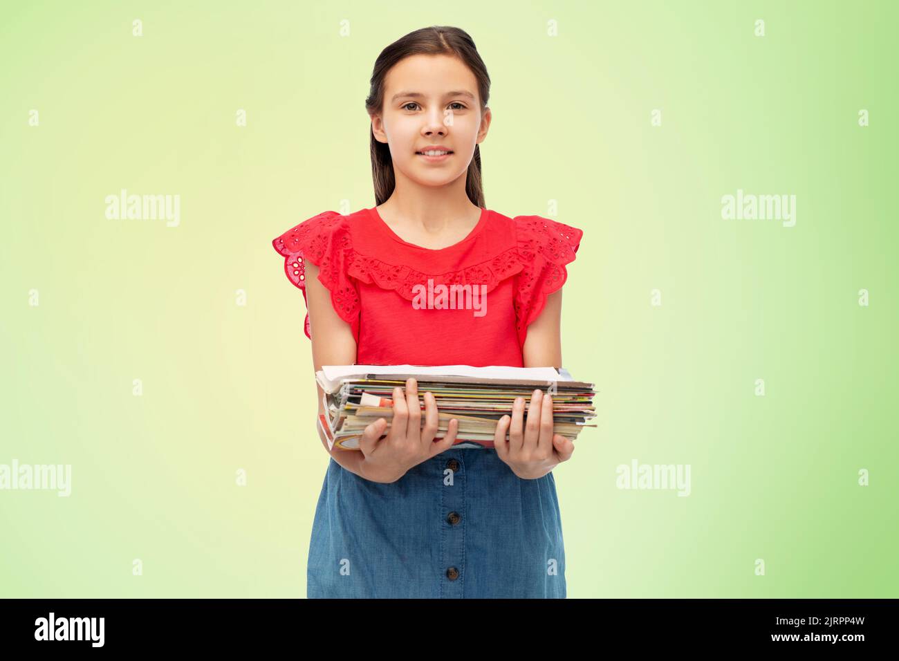 smiling girl with magazines sorting paper waste Stock Photo - Alamy