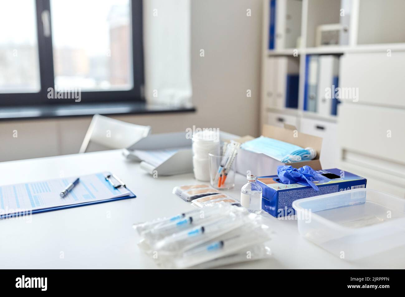 syringes and medicine on table at hospital Stock Photo - Alamy