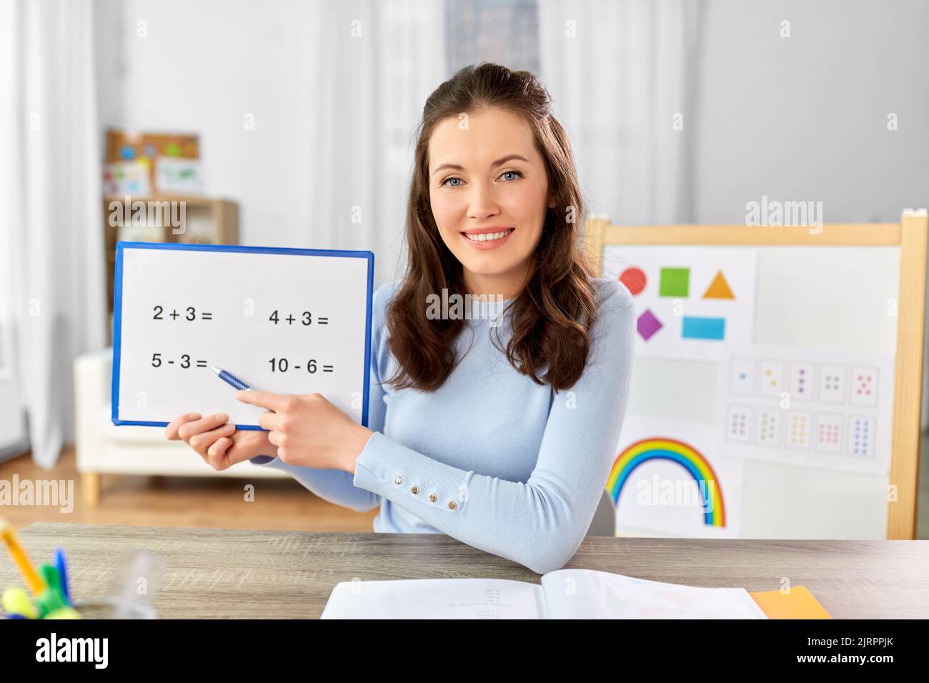 math teacher having online class at home Stock Photo - Alamy