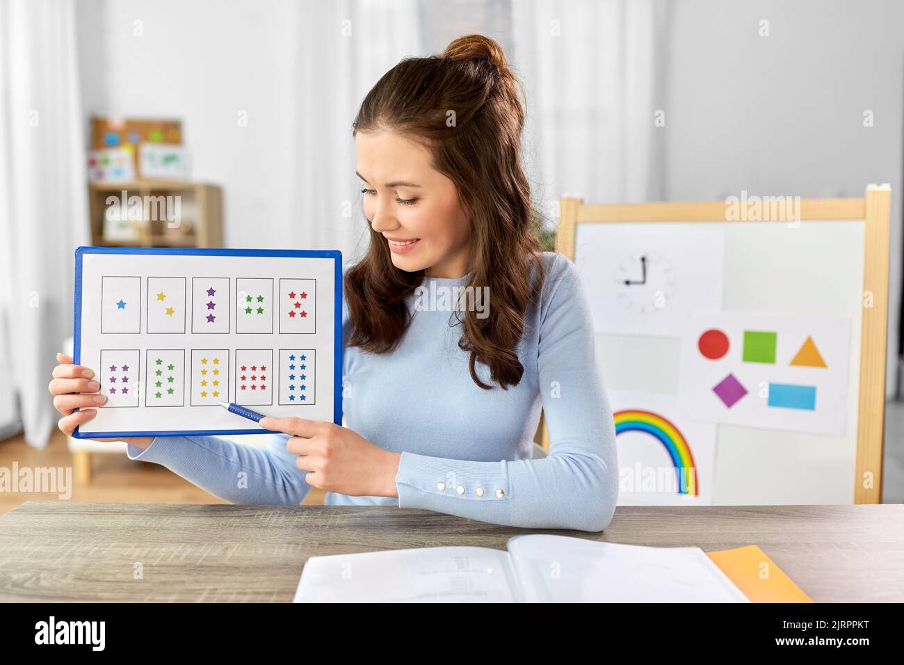math teacher having online class on laptop at home Stock Photo - Alamy