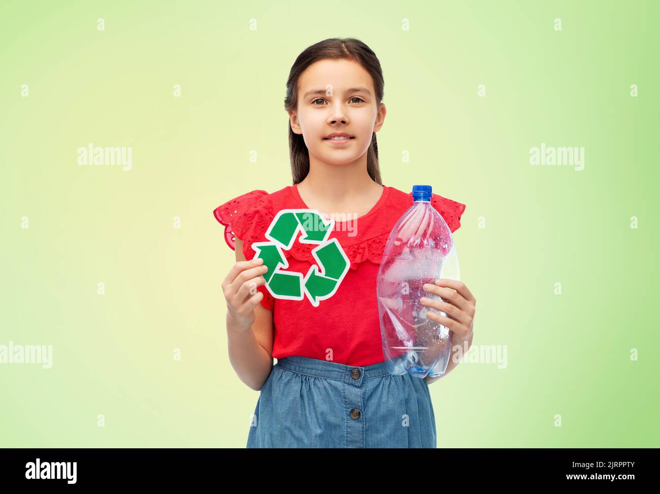 girl with green recycling sign and plastic bottle Stock Photo - Alamy