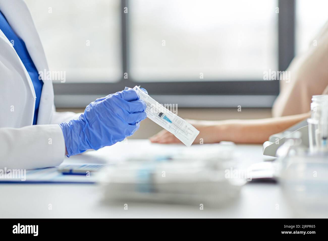 female doctor with syringe and patient at hospital Stock Photo - Alamy