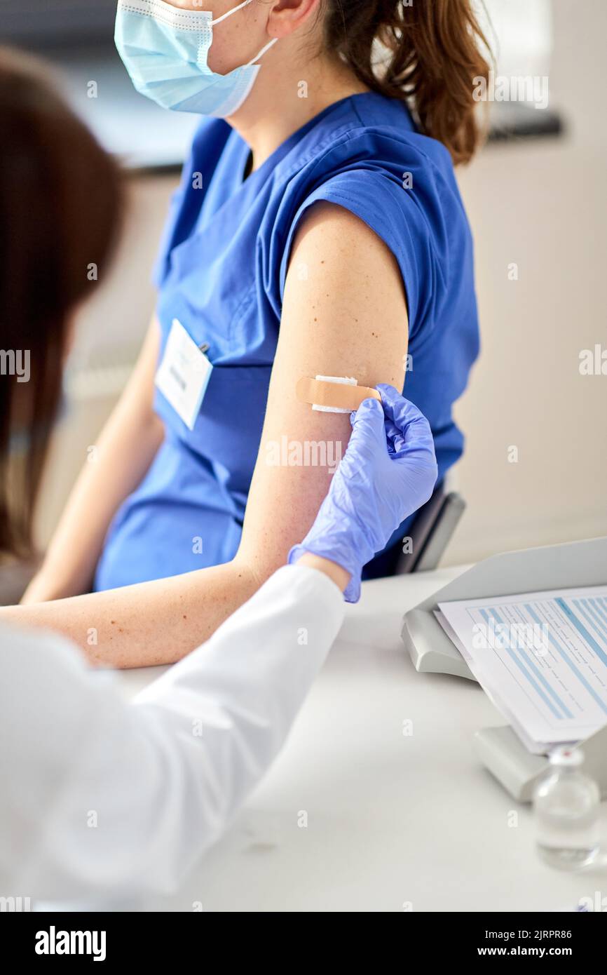 Doctor attaching patch medical hi-res stock photography and images - Alamy