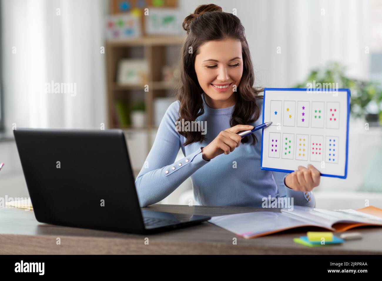 math teacher having online class on laptop at home Stock Photo - Alamy