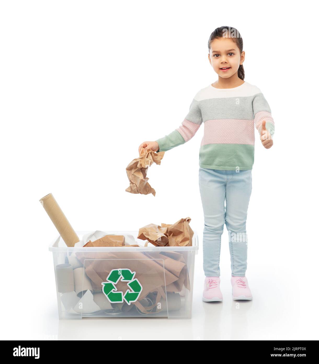 girl sorting paper waste and showing thumbs up Stock Photo - Alamy