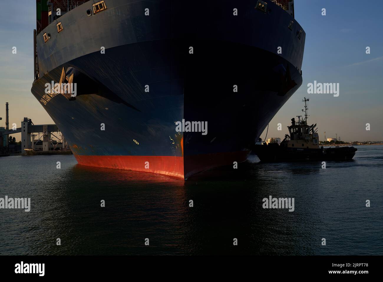 Odessa, Ukraine SIRCA 2019: A tugboat pushes container ship at port ...